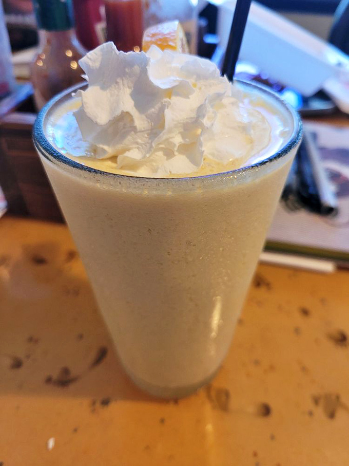 This creamsicle smoothie isn't just a drink, it's a time machine. One sip and you're suddenly eight years old, chasing the ice cream truck down the street.