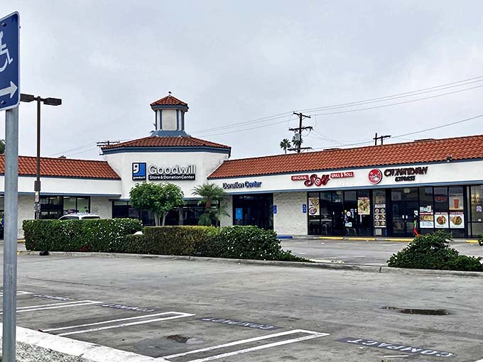 Even on a cloudy day, this Goodwill shines as a beacon of bargain hunting. Note the neighboring restaurants for post-shopping refueling.