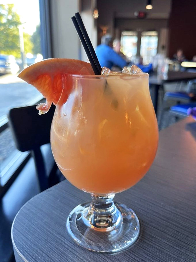 This isn't just a cocktail; it's liquid sunshine in a glass, garnished with grapefruit that adds just the right amount of sass to your evening.