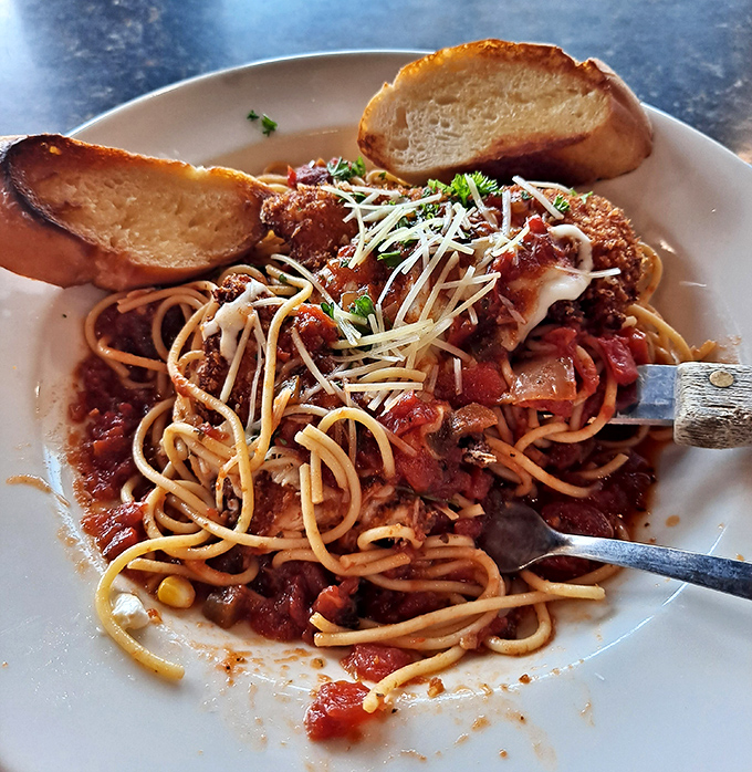 Spaghetti and garlic bread that could make an Italian grandmother nod in approval &ndash; simple, hearty, and exactly what you're craving.