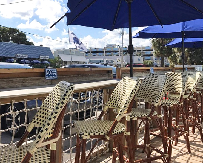 Nautical-themed outdoor seating where salt air enhances every bite, and strangers become friends over shared recommendations and seafood envy.