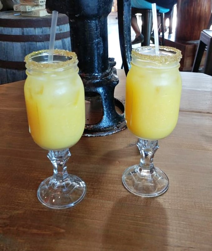 Mason jar mimosas: where farm charm meets brunch sophistication. These sunshine-colored beauties are vacation in a glass.