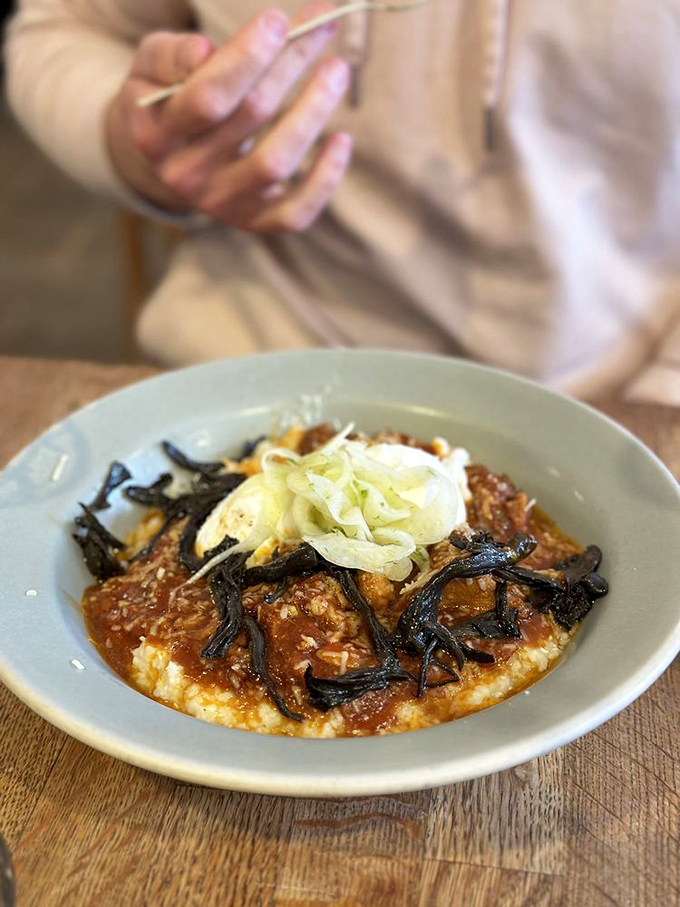 Grits this creamy and pork this tender suggest someone in the kitchen understands that comfort food isn't just about nostalgia&mdash;it's about excellence.