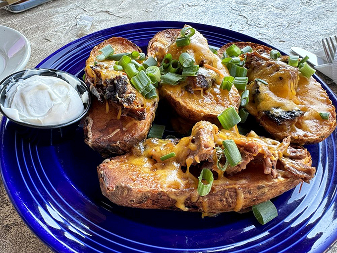 Potato skins elevated to an art form&mdash;crispy vessels carrying melted cheese, tender brisket, and the promise of immediate happiness.