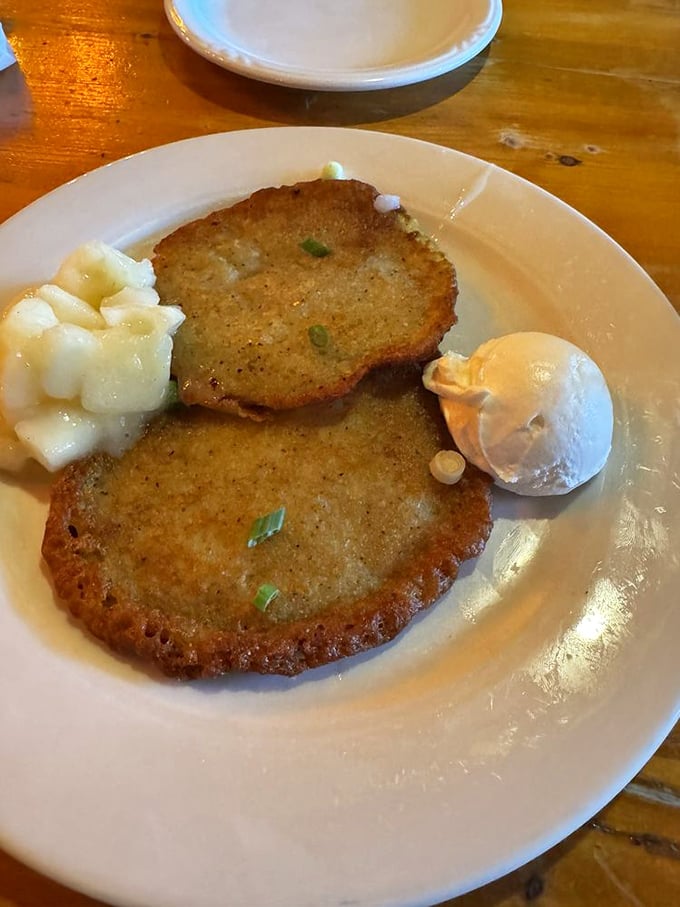 Golden-crisp potato pancakes that crackle with each bite, served with the classic dilemma: applesauce or sour cream? The correct answer is always "both."