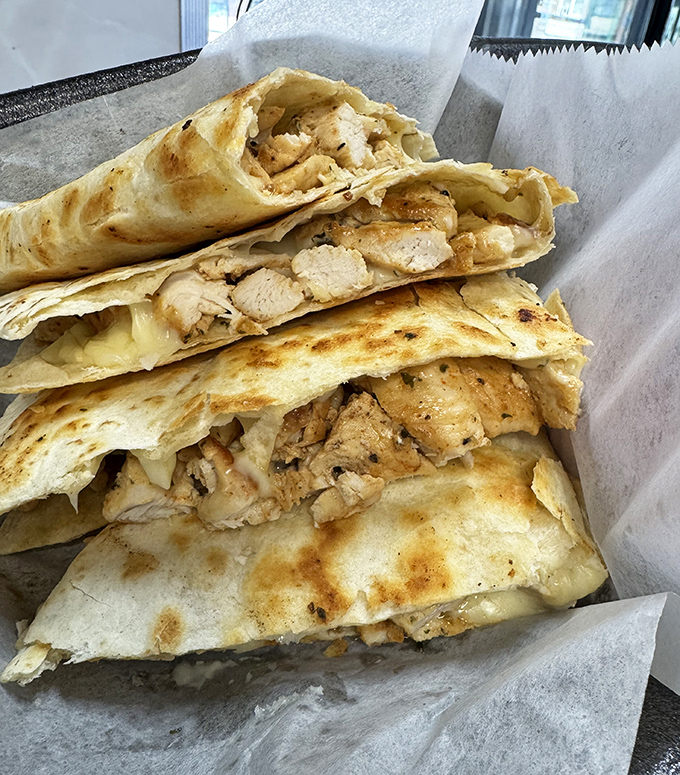 Quesadillas stacked like delicious library books – each one a different chapter in the story of "Things That Taste Better With Cheese."