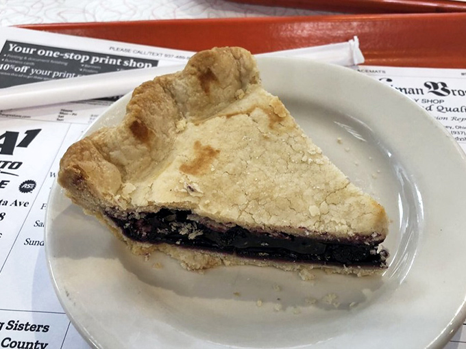 This slice of pie isn't just dessert&mdash;it's a sweet-tart symphony in a flaky crust, the kind that makes you close your eyes and forget your table manners.