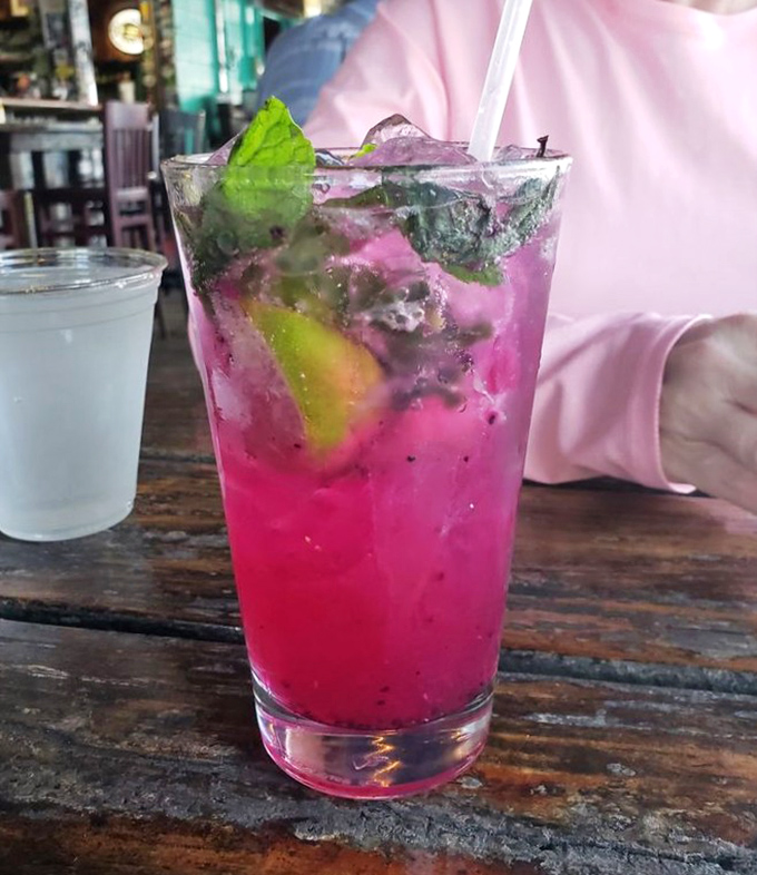 This dragonfruit mojito looks like a sunset decided to take a swim in your glass and stay awhile.