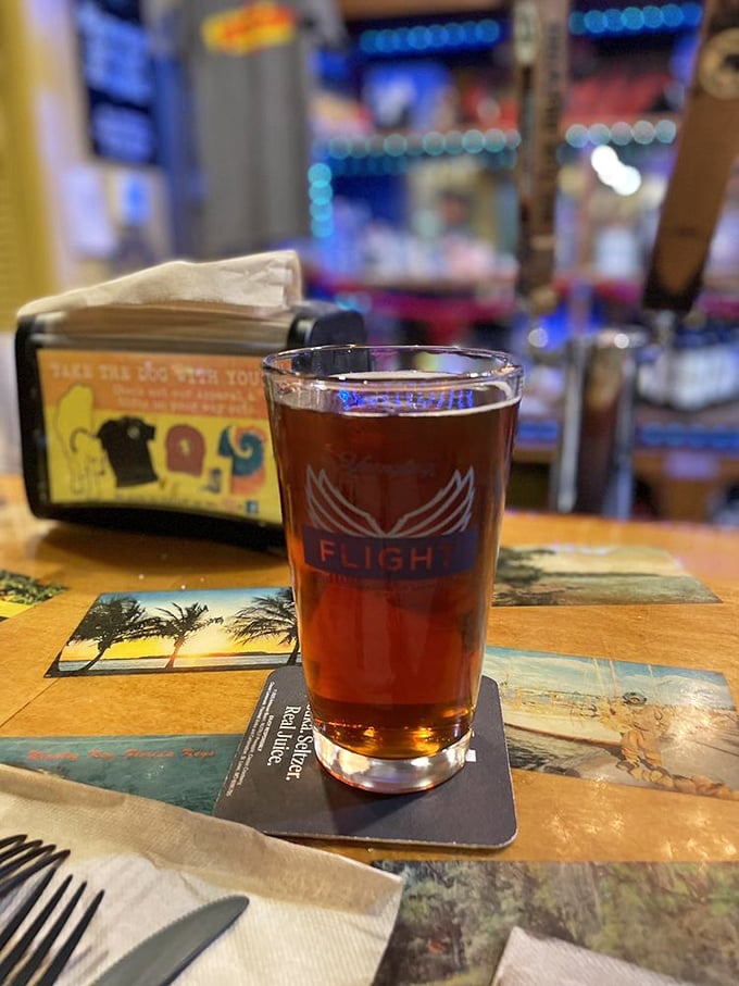 A perfectly poured craft beer on a Florida-themed coaster&mdash;because great BBQ deserves an equally thoughtful beverage companion.