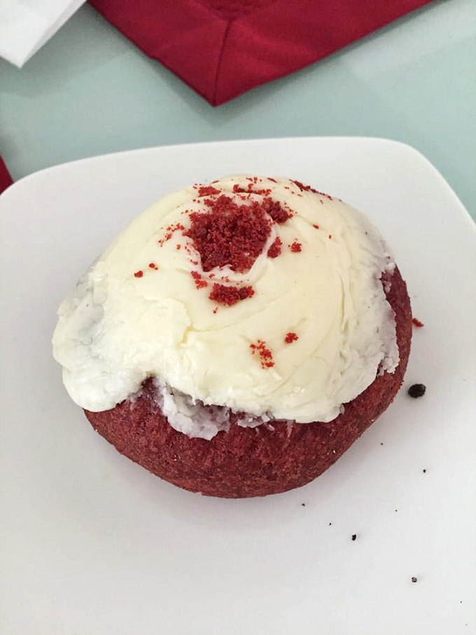 Red velvet donut with cream cheese frosting&mdash;proving that formal wear for baked goods is always a good idea.