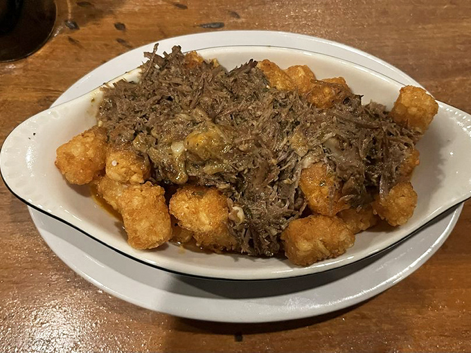 Tater tots all grown up with their inheritance. Crispy potato bites draped in savory toppings&mdash;like your childhood favorite that went to culinary school.