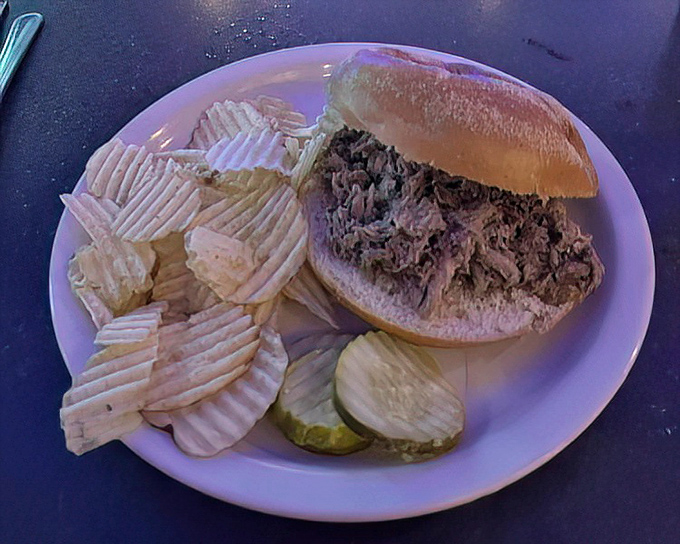 This roast pork sandwich isn't just food—it's an edible love letter from Pennsylvania to your taste buds. The pickle adds that perfect acidic counterpoint.