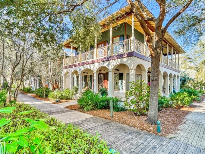 Colorful shutters and wraparound porches bring New Orleans charm to the Florida coast, creating shaded retreats from the midday sun.