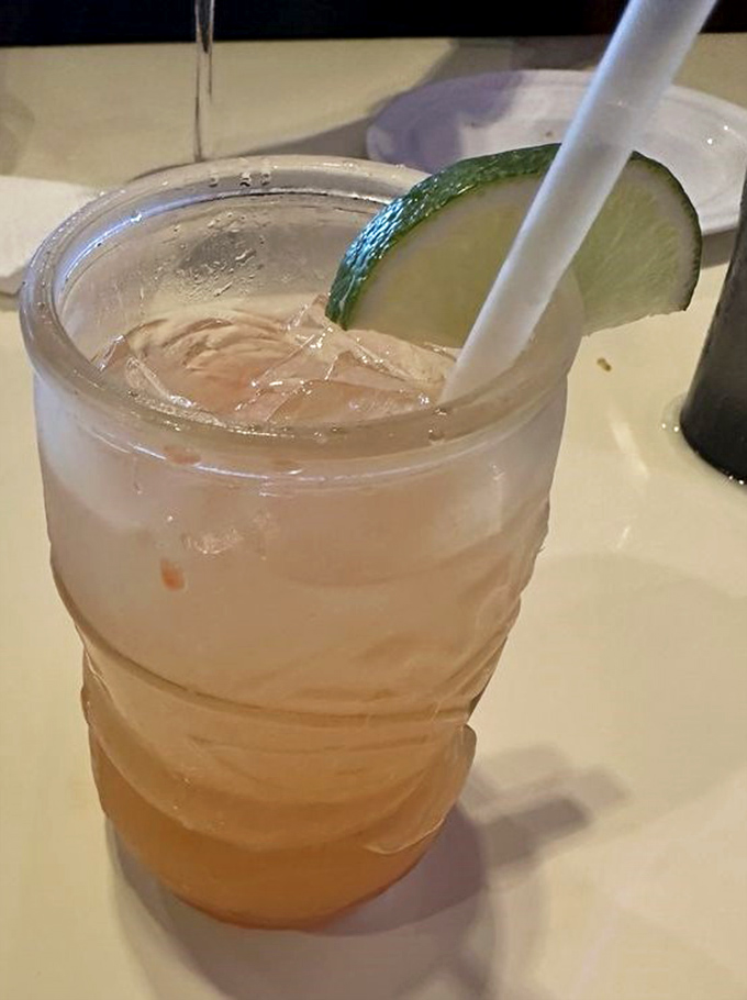 A rum punch garnished with lime&mdash;because sometimes the perfect seafood companion isn't wine but a tropical sipper that screams "vacation mode: activated."