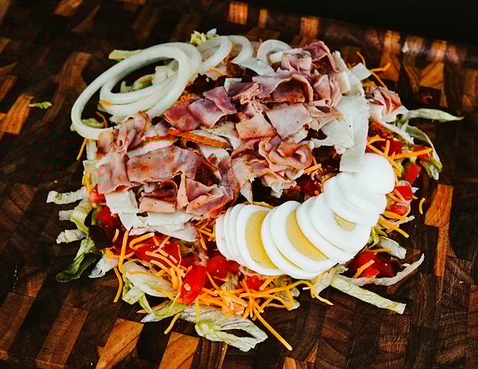 A chef salad that doesn't apologize for being generous with the good stuff. This isn't diet food &ndash; it's satisfaction in vegetable form.