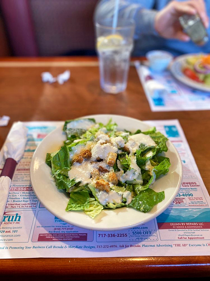 Fresh Caesar salad with golden croutons offers a lighter option that doesn't skimp on flavor.