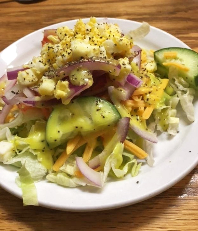 Fresh salad provides the virtuous counterpoint to all that delicious indulgence awaiting nearby.