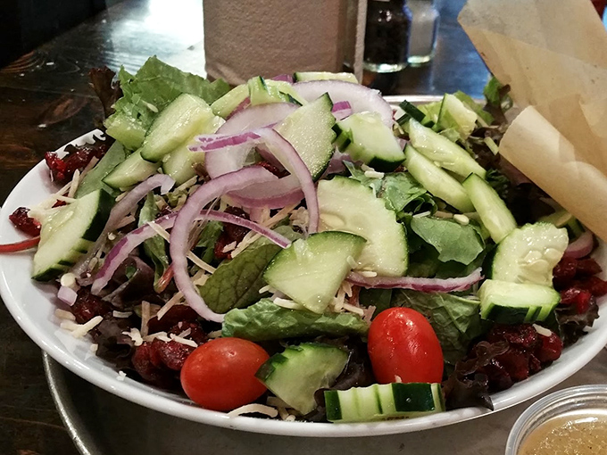 A fresh, vibrant salad offering temporary reprieve from meat overload. The barbecue equivalent of a palate cleanser.