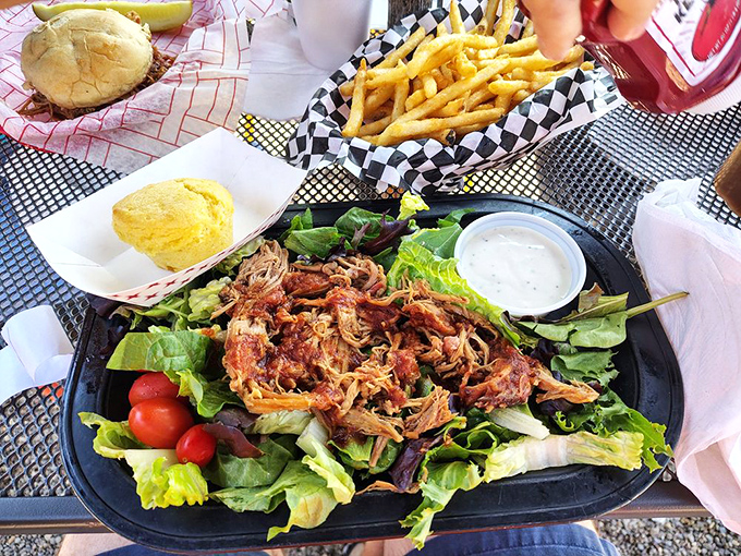 Even salad gets the star treatment here&mdash;pulled pork lounging on crisp greens like it's at a spa day, bringing smoky sophistication to the veggie party.