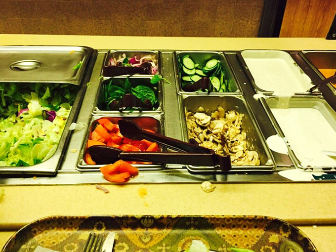 The salad bar setup isn't trying to win Instagram followers&mdash;it's trying to win your heart with fresh ingredients before the main event arrives.