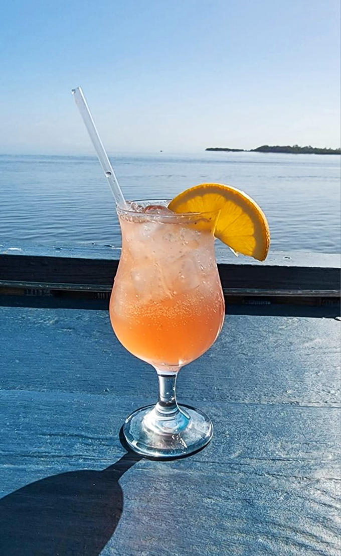 A sunset-colored cocktail with the Gulf of Mexico as backdrop. Some drinks just know how to make an entrance.