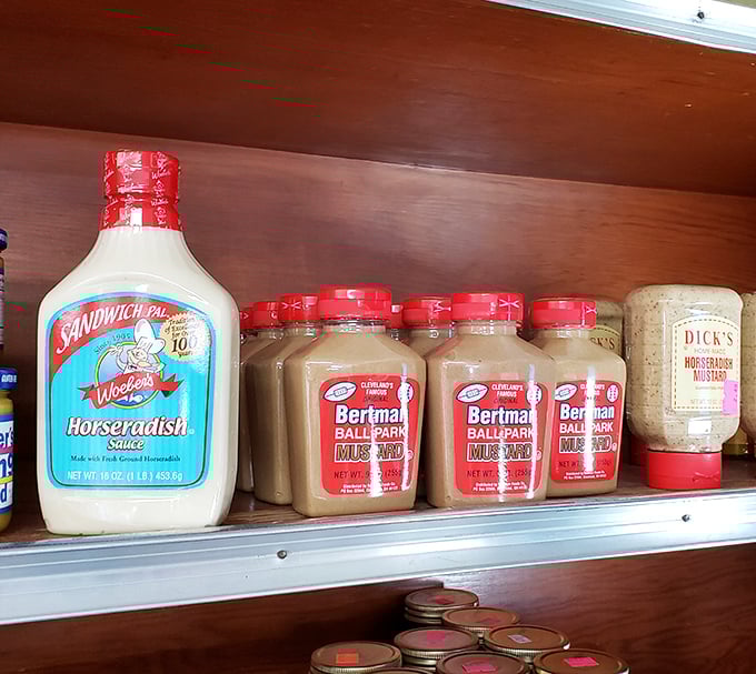 The condiment shelf at Shisler's&mdash;where sandwich mediocrity goes to die. That Bertman Ball Park Mustard has transformed countless meals.