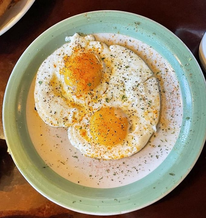 These sunny-side up eggs swimming in creamy sauce aren't just breakfast, they're an argument against ever skipping the most important meal of the day.