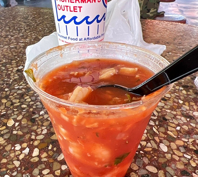 Seafood cocktail that puts happy hour to shame. This cup of oceanic treasures swimming in tangy sauce delivers vacation vibes with every spoonful.