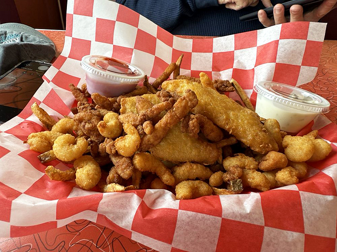 Fried seafood heaven in a red checkered basket. The kind of indulgence that makes diets take a day off.