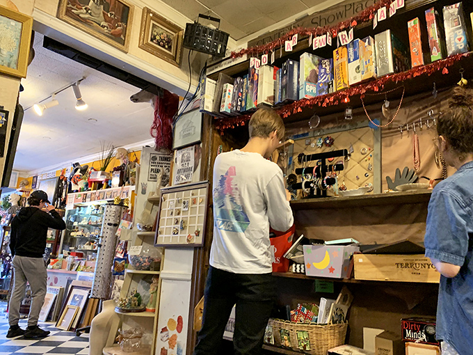 The universal thrift store pose: examining treasures while mentally rearranging your entire living room.