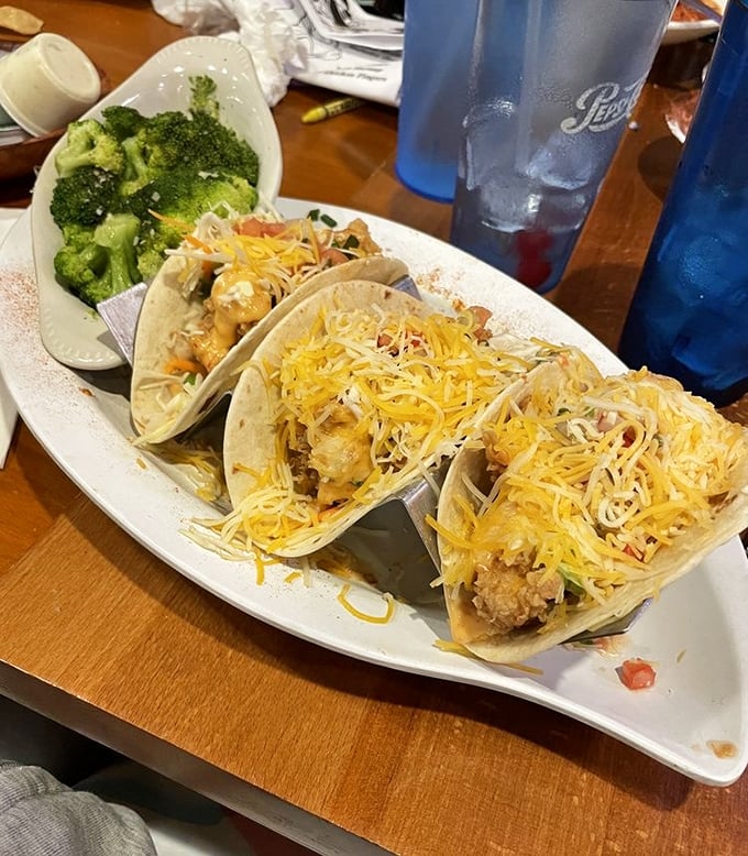 Fish tacos: where the ocean meets land in perfect harmony. Add shredded cheese, pair with fresh broccoli, and suddenly Tuesday dinner feels like a celebration.