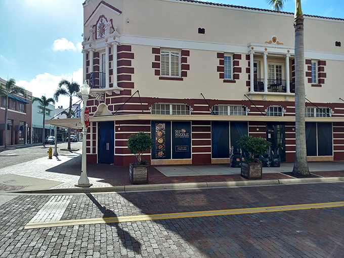 This historic building with its distinctive burgundy accents adds character to Fort Myers' streetscape. Brick streets and vintage architecture—some things improve with age.