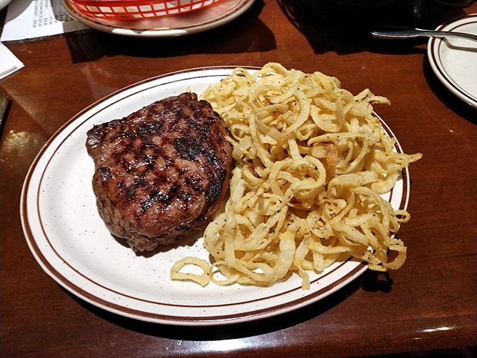 A perfectly seared sirloin alongside a mountain of those famous onion straws &ndash; a pairing more perfect than Bogart and Bacall.