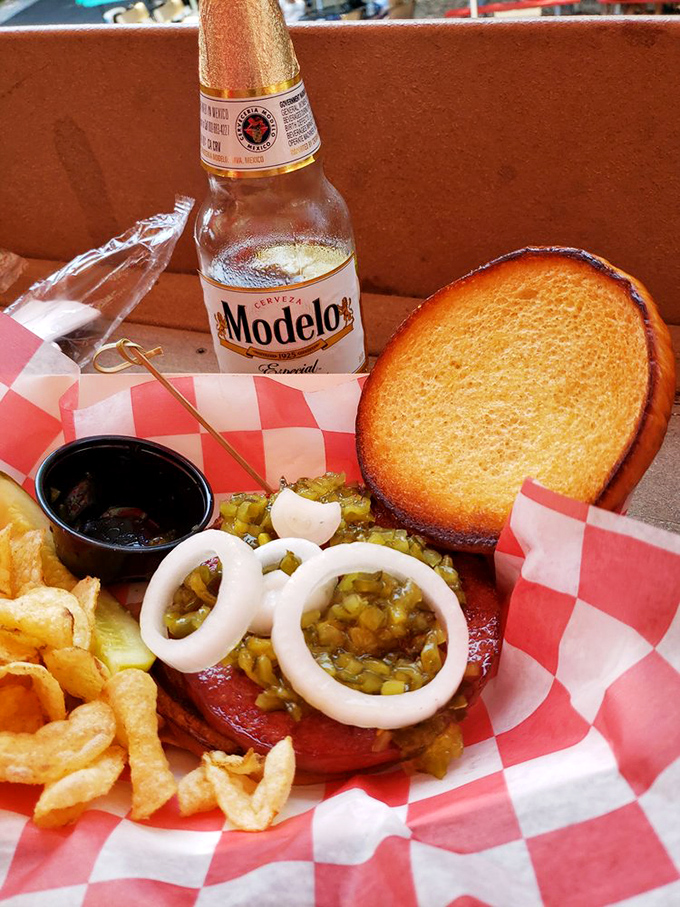 A symphony of savory satisfaction&mdash;cold beer, hot bologna, and those onion rings that make you forget your diet resolutions instantly.