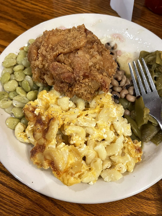 A plate that tells the story of generations of Southern cooks. Mac and cheese with those coveted crispy edges worth fighting your siblings for.