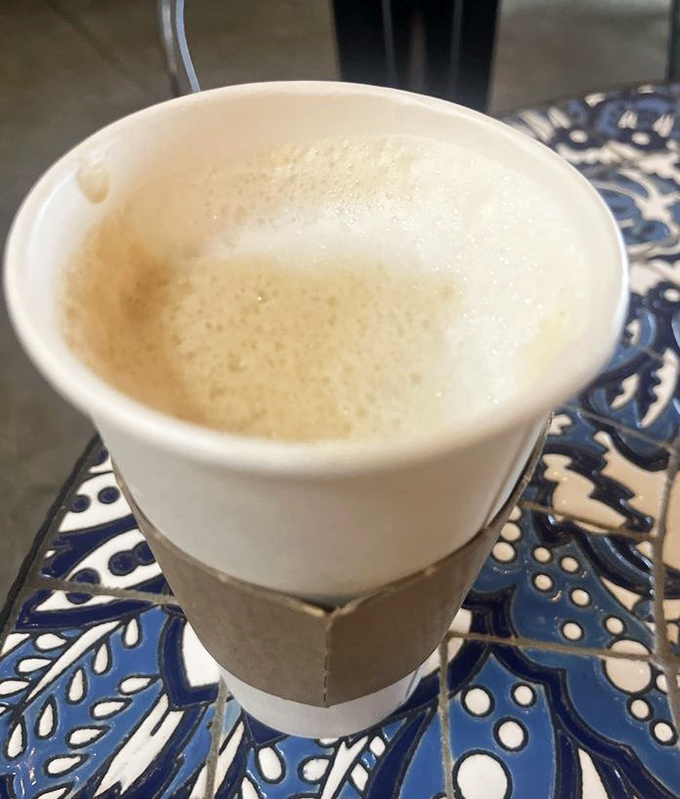 That coffee isn't just wearing a cardigan sleeve to look cute&mdash;it's the caffeinated liquid courage you need to face Florida's humidity.
