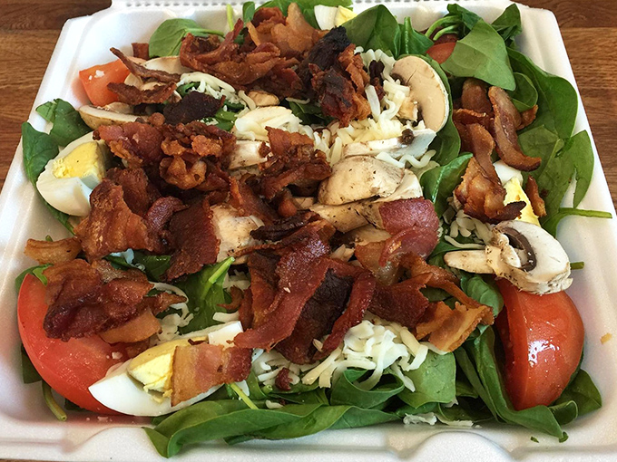 Even salads get the royal treatment at Fred's, with crisp greens playing host to a party of bacon, eggs, and veggies.