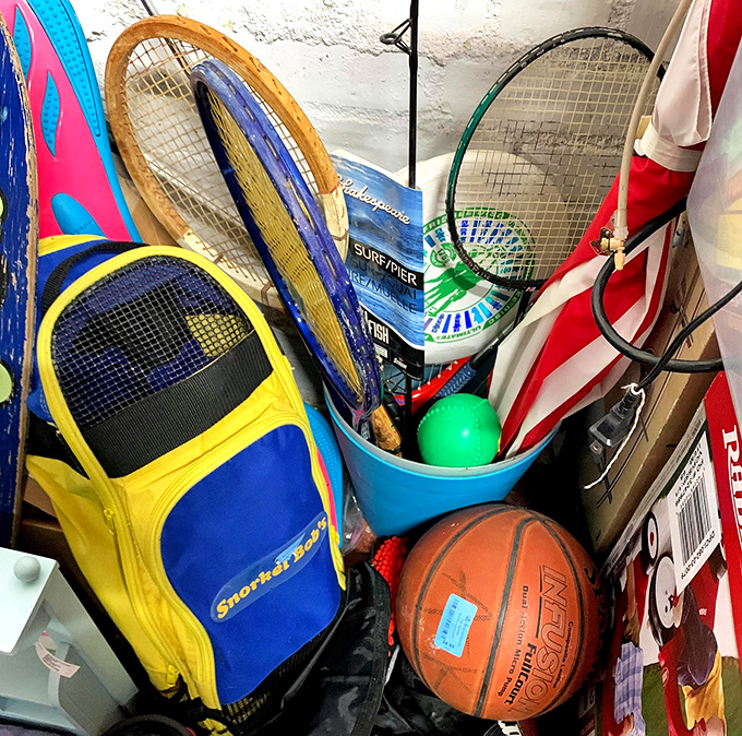 The sports equipment corner: where abandoned tennis rackets and basketballs await their second shot at glory.