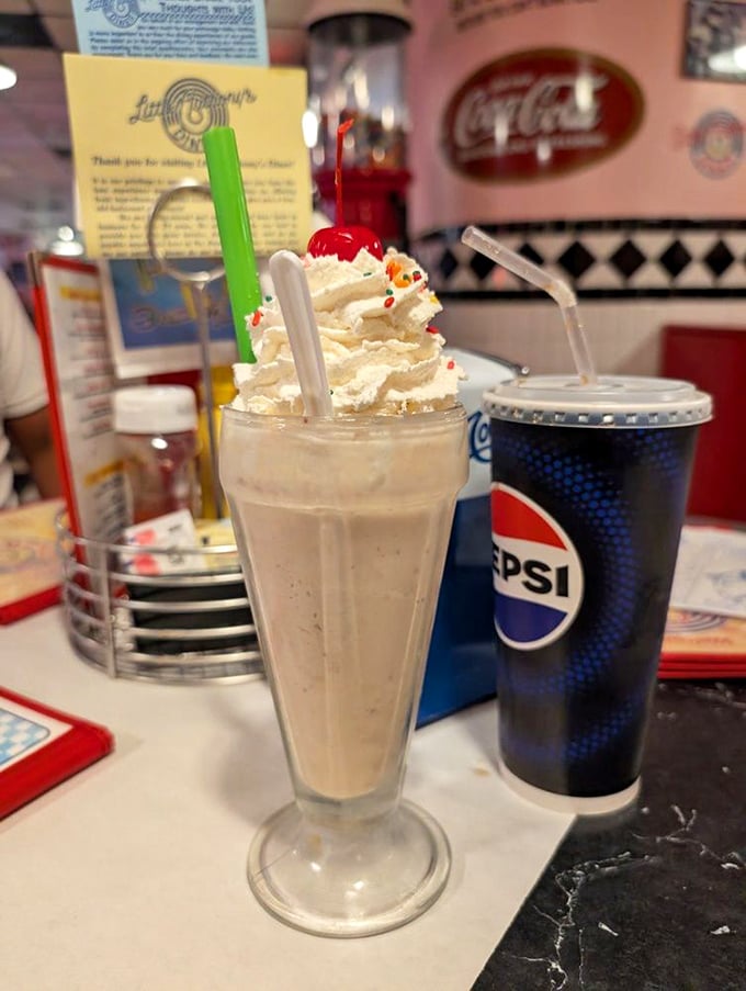 This isn't just a milkshake—it's a frothy monument to dairy perfection, topped with enough whipped cream to make your dentist wince.