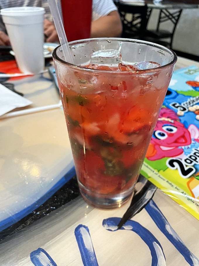 That strawberry cocktail isn't just a drink&mdash;it's summer in a glass, mingling with fresh basil for a refreshing break between seafood conquests.