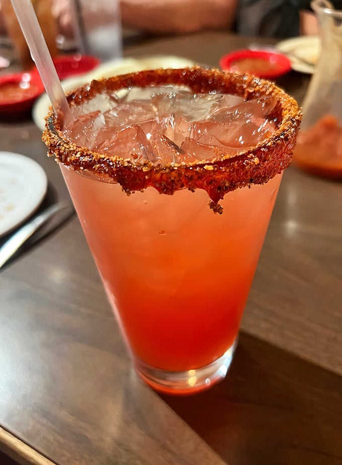 This strawberry margarita sports a chili-rimmed glass that's prettier than most sunsets and twice as satisfying to sip.