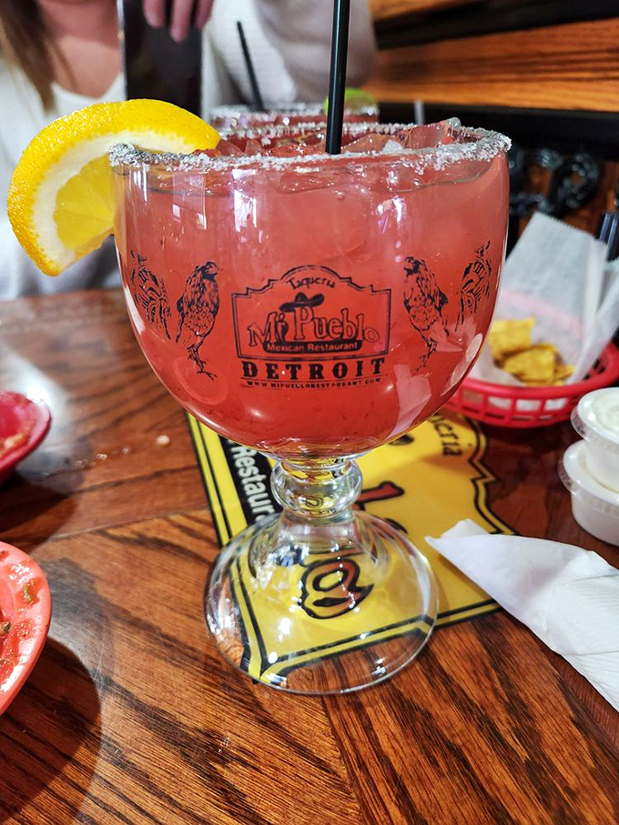 The strawberry margarita comes in a glass big enough to swim in. That salt rim isn't just decoration&mdash;it's the perfect counterpoint to sweet-tart perfection.