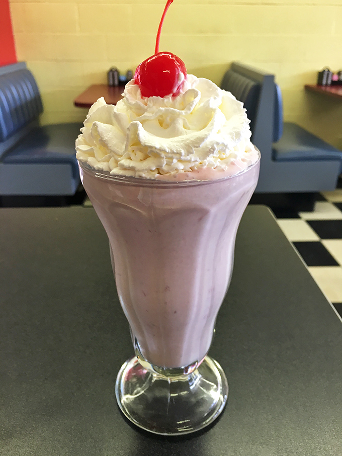 That's not just a milkshake, it's a pink cloud topped with whipped cream that happens to taste like summer memories and childhood joy.