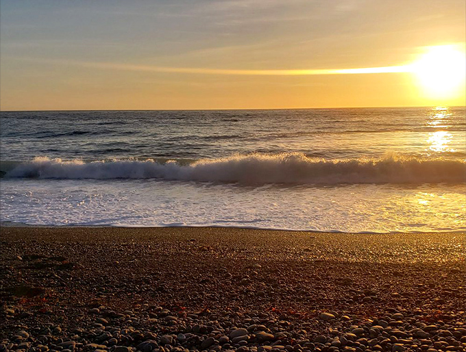 Golden hour transforms the obsidian shore into a glittering wonderland&mdash;Mother Nature's ultimate light show.