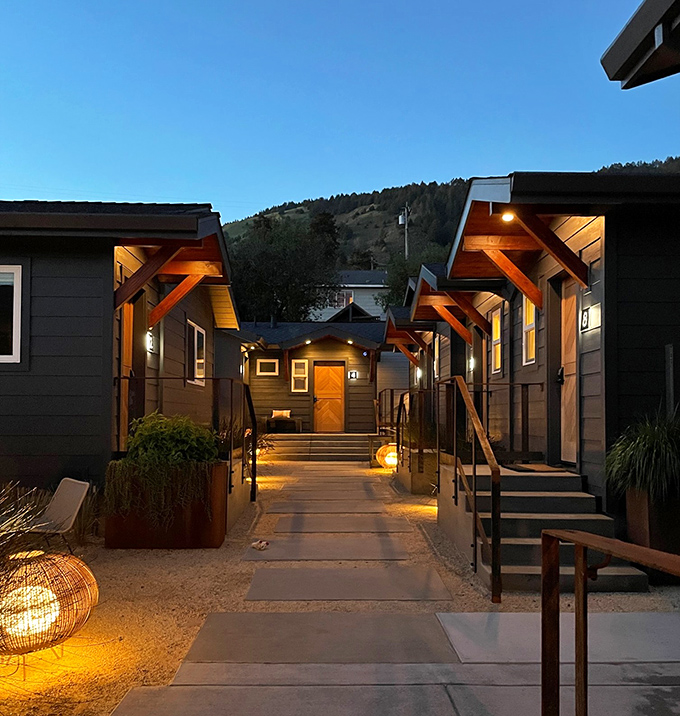 The Surf Lodge pathway glows with warm light at dusk, creating the kind of ambiance that makes you whisper conversations even when no one's sleeping.