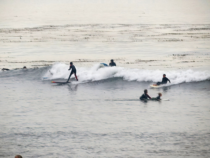 Surf's up in Capitola, where wave riders of all levels find their rhythm in the gentle rollers of Monterey Bay.