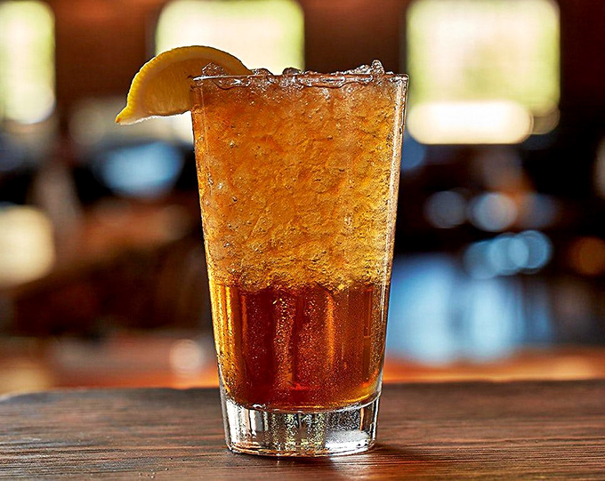 Sweet tea so perfectly amber it could be mistaken for liquid topaz—the unofficial champagne of the South, served in a glass big enough for baptisms.