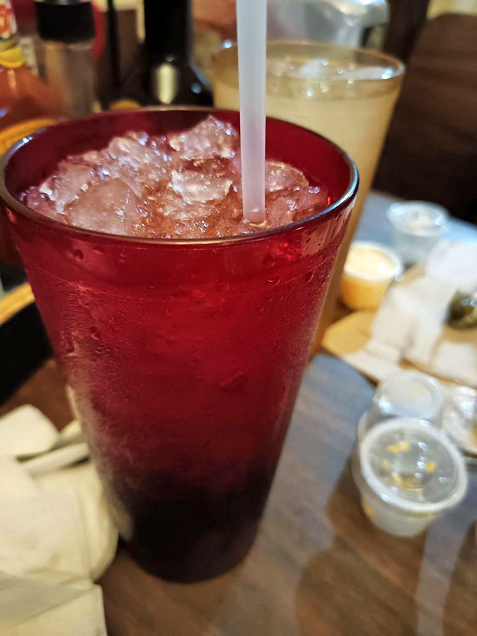 That sweet tea isn't just a beverage&mdash;it's liquid Southern hospitality served in a ruby-red glass that sweats almost as much as you will in a Dallas summer.