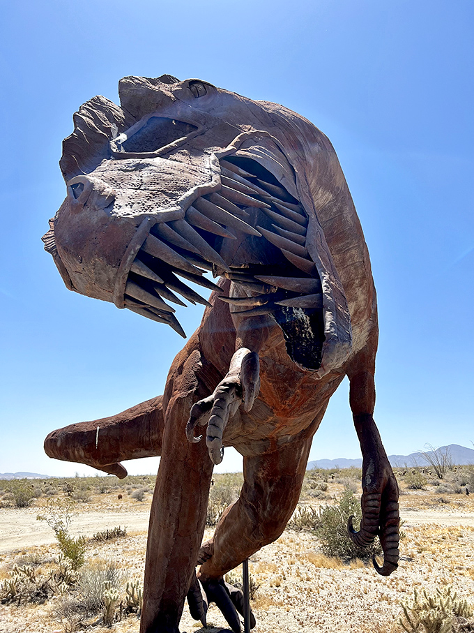 Prehistoric power pose! This imposing dinosaur sculpture reveals the artist's incredible attention to detail, from razor-sharp teeth to perfectly balanced stance.