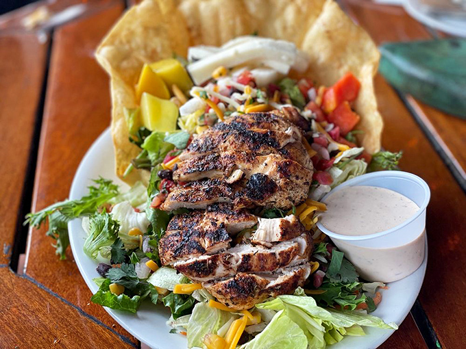 Blackened chicken perched atop a garden of greens and veggies&mdash;proof that seafood restaurants can still nail a land-based dish.